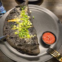 Black Crust Pizzeria - Vik Restaurant - HappyCow
